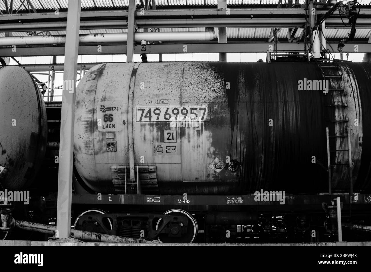 Oil train wagons on oil refinery Stock Photo - Alamy