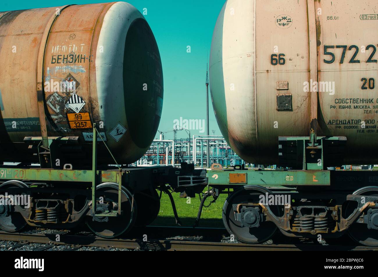 Oil train wagons on oil refinery Stock Photo - Alamy