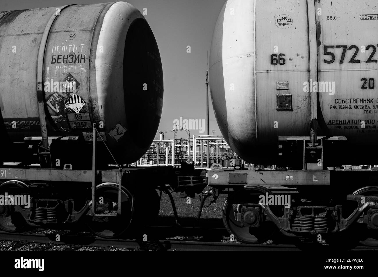 Oil train wagons on oil refinery Stock Photo - Alamy