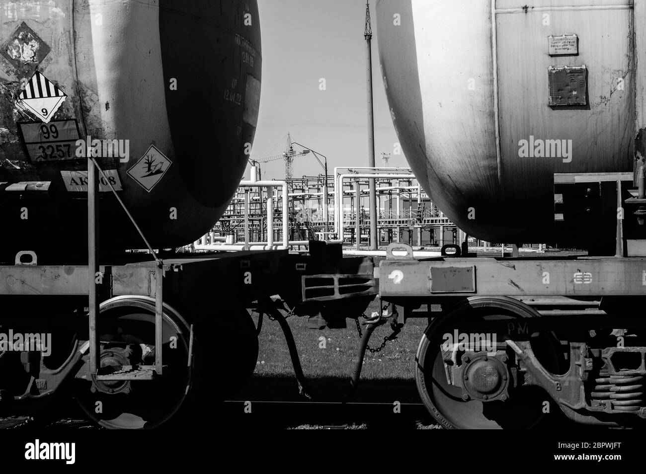 Oil train wagons on oil refinery Stock Photo - Alamy