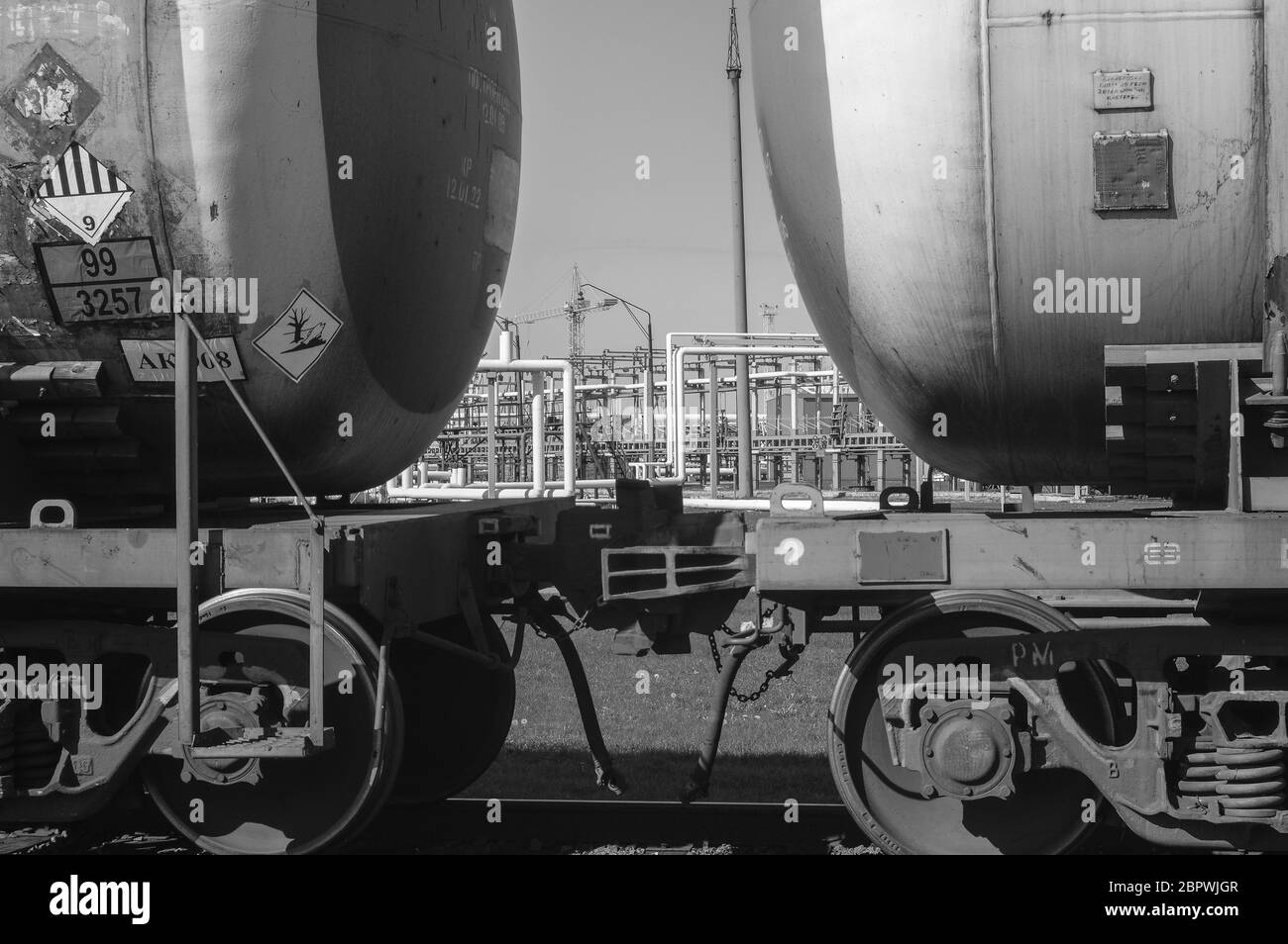 Oil train wagons on oil refinery Stock Photo - Alamy