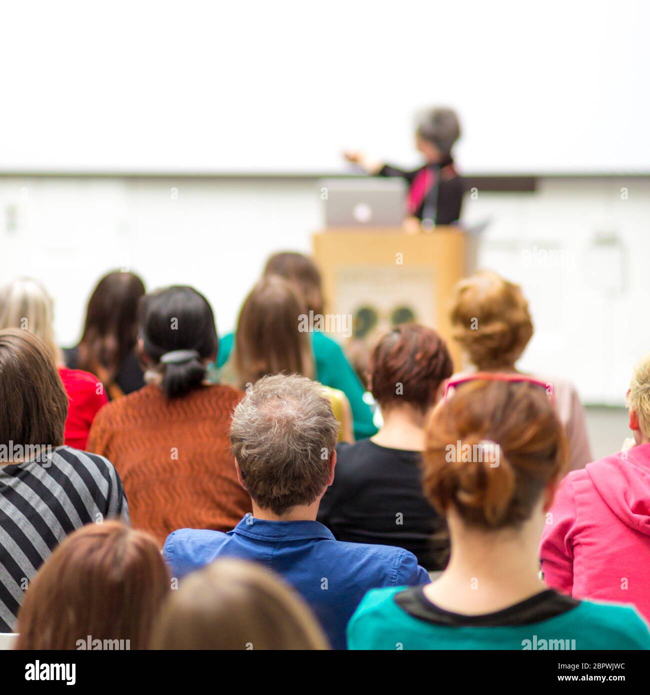 Woman giving presentation on business conference Stock Photo - Alamy