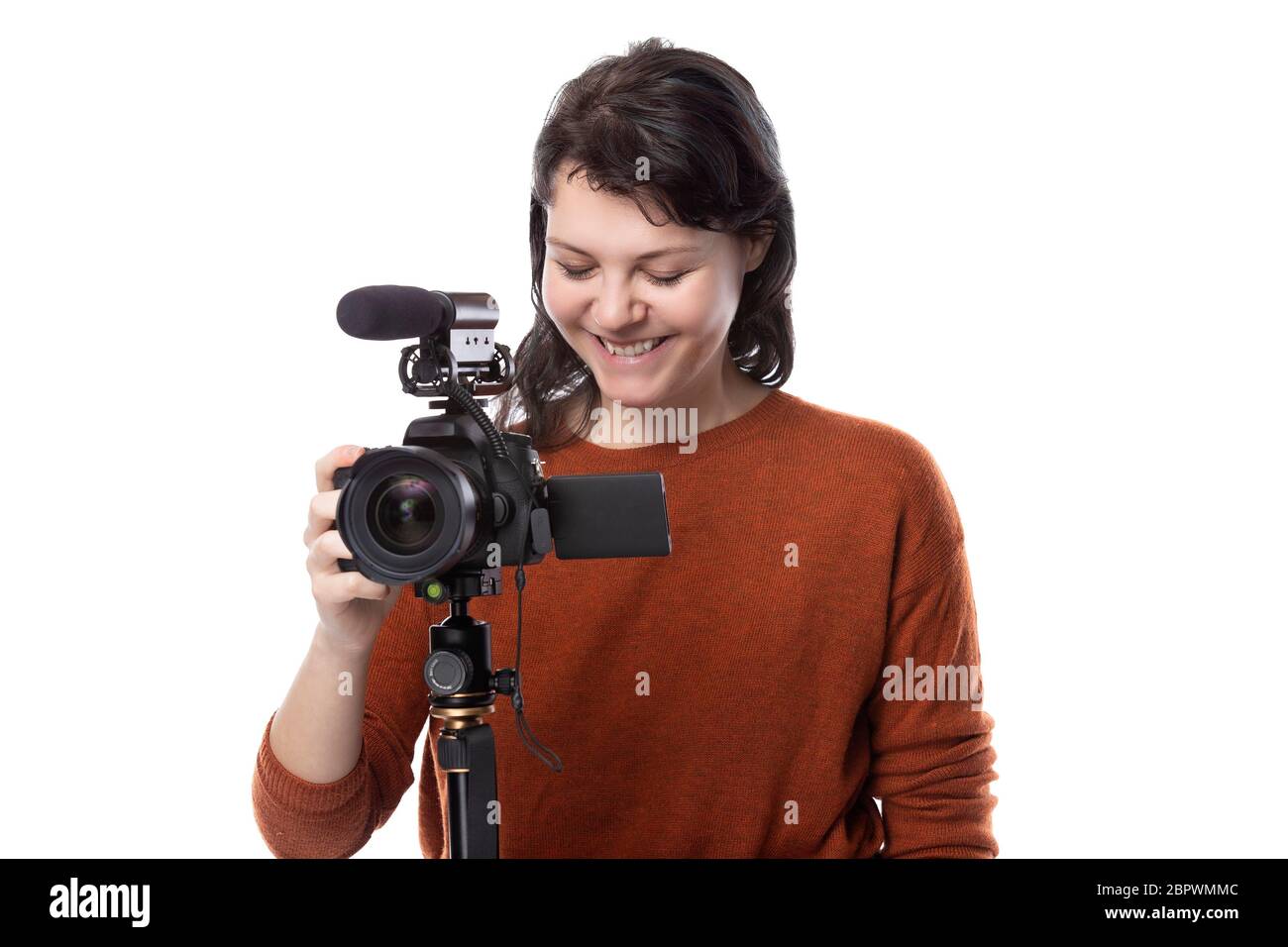 Female art student studying to be a filmmaker using a camera on a ...