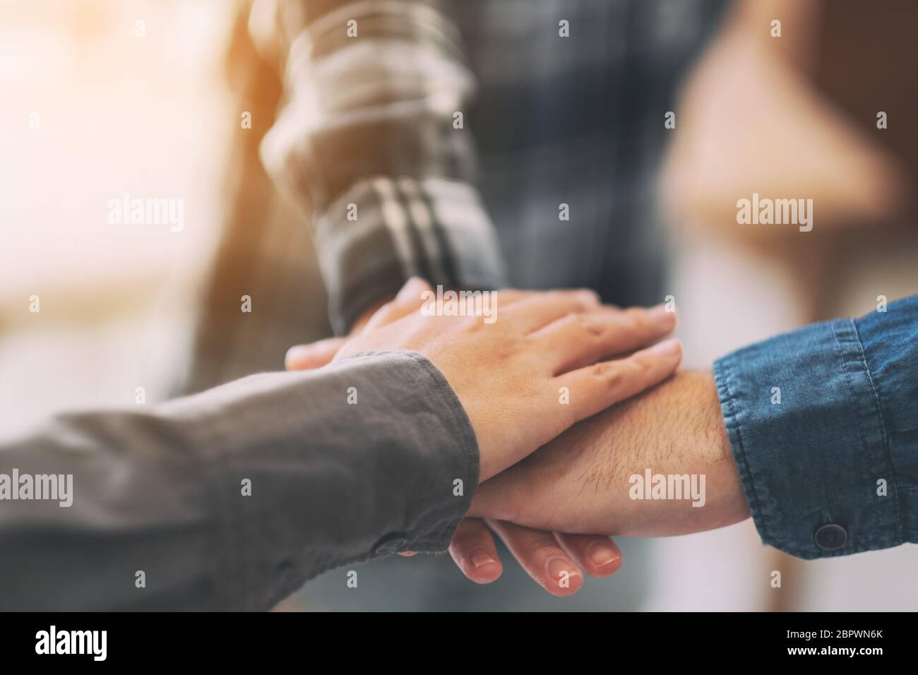 Businessman putting their hands together in the meeting Stock Photo - Alamy