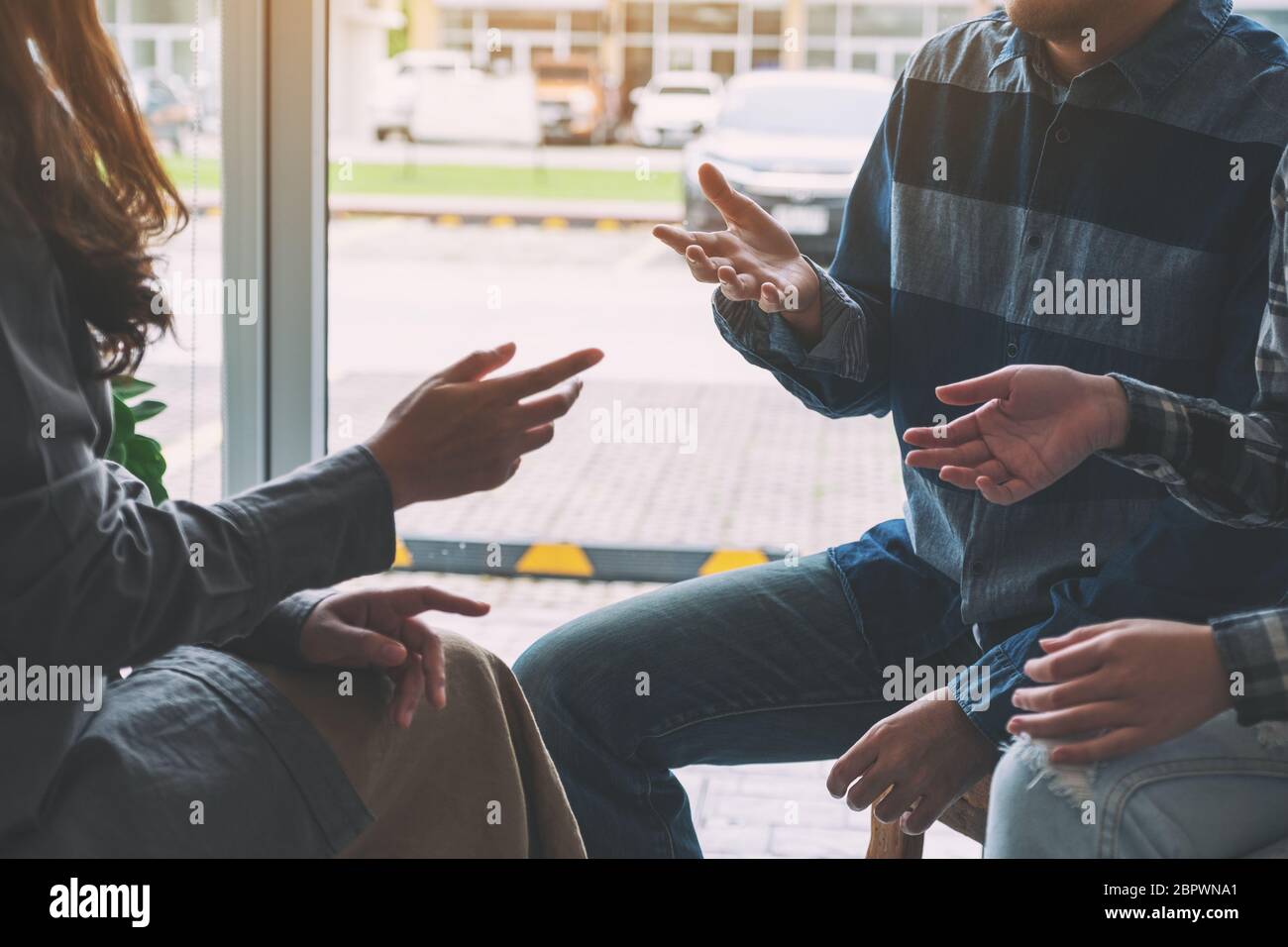 People sitting and talking together Stock Photo - Alamy