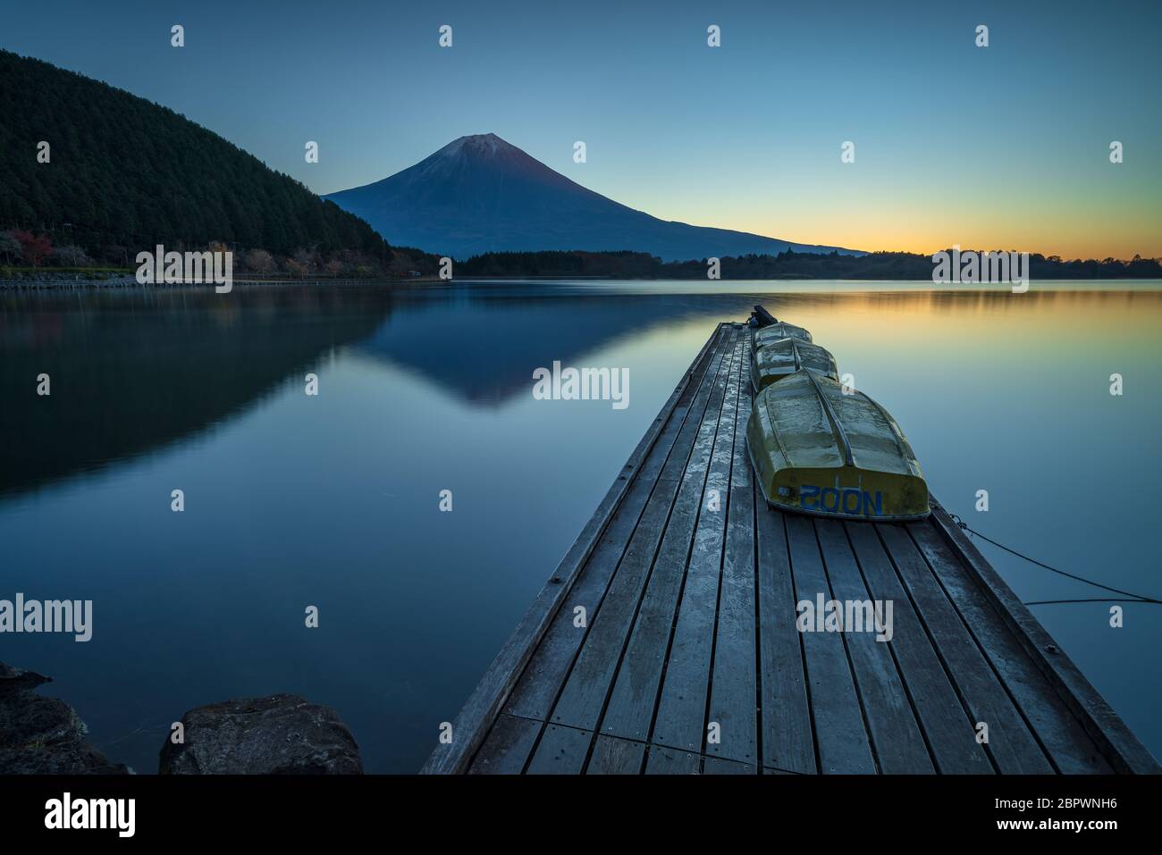 Mount Fuji taken at sunrise from the jetty at lake Tanuki, Japan Stock ...