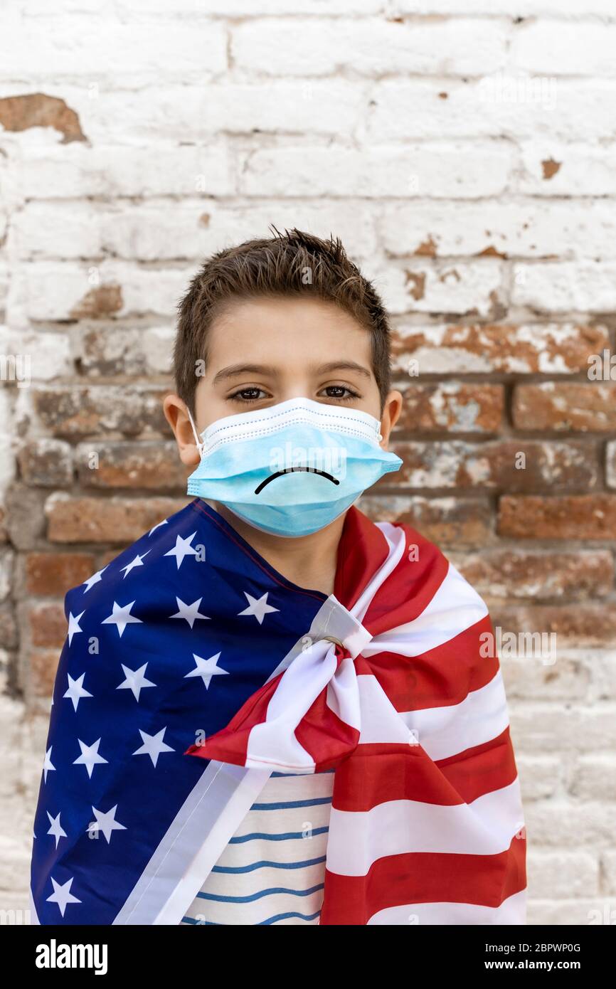 Sad boy with a face mask and american flag Stock Photo - Alamy