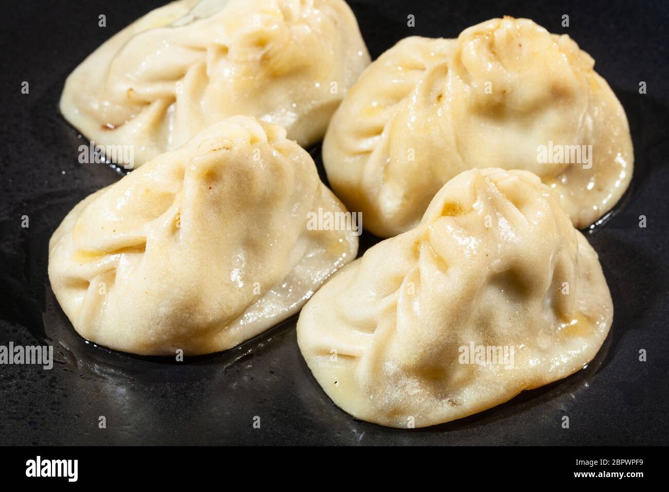 Black dumpling hi-res stock photography and images - Alamy