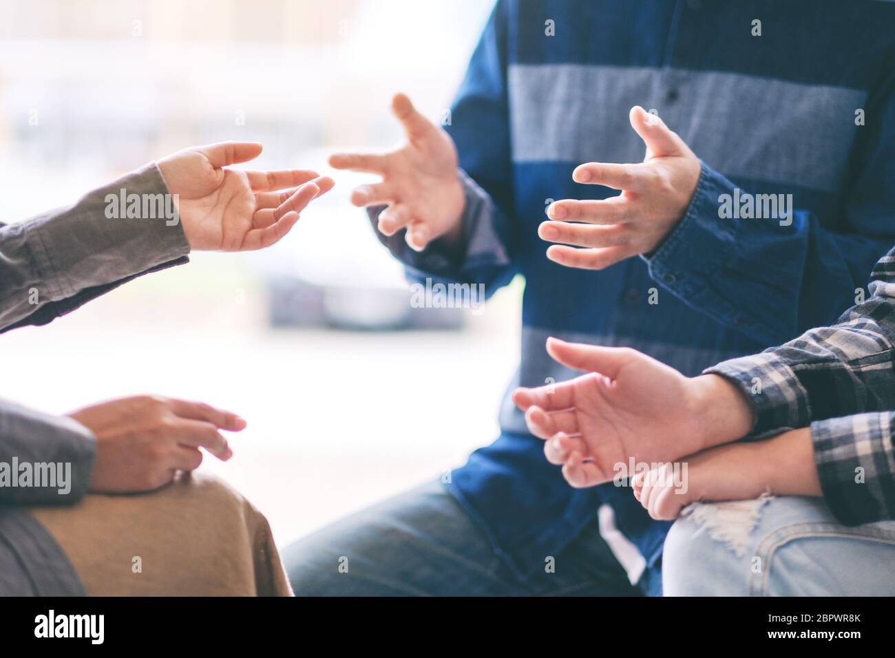 People sitting and talking together Stock Photo - Alamy