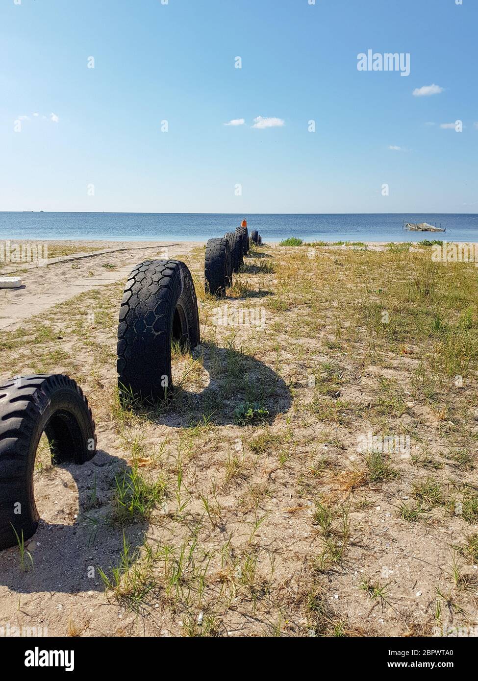 Half buried tires hi-res stock photography and images - Alamy