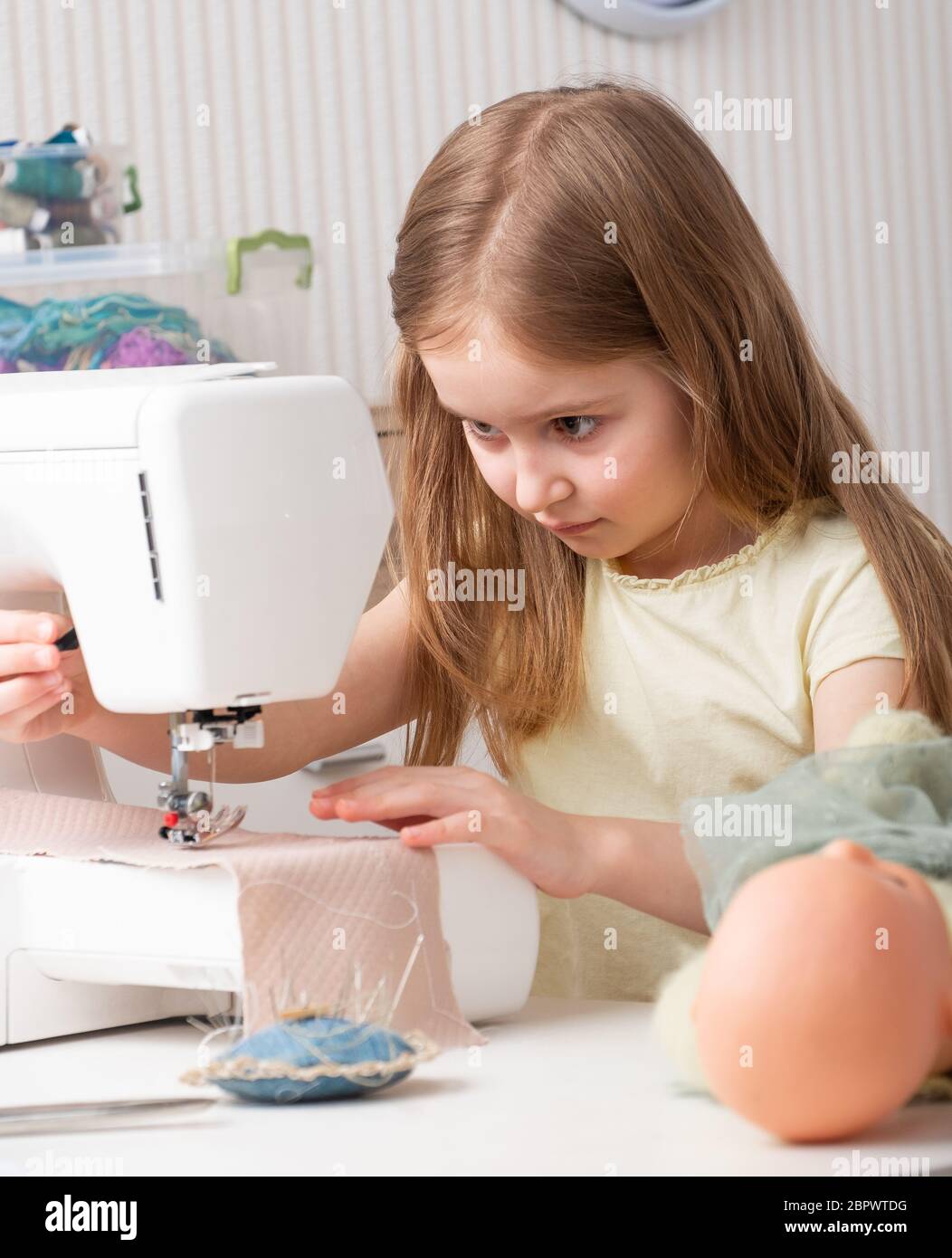 Girl with sewing machine hi-res stock photography and images - Alamy
