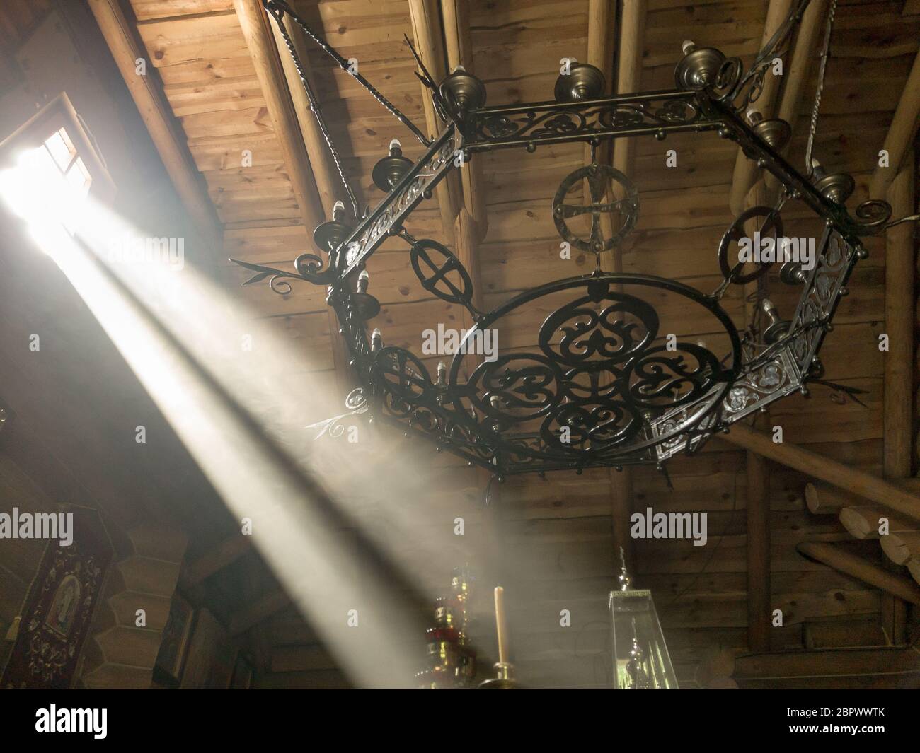 The rays of the sun make their way through the windows and cracks of ...