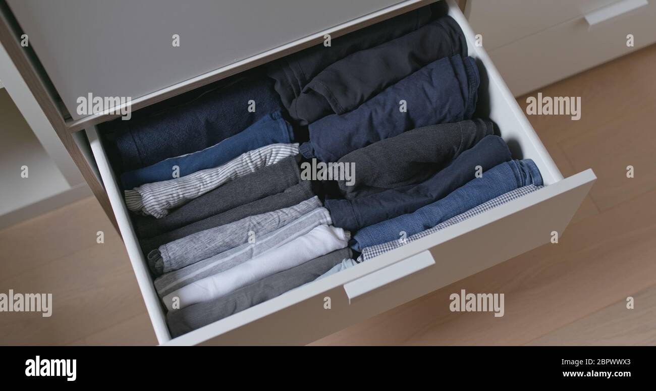 Open the drawer with clothes Stock Photo - Alamy