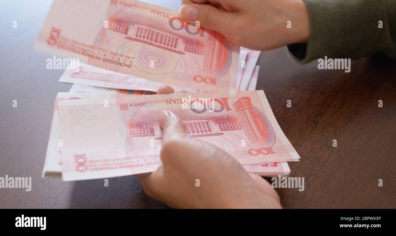 Woman counting RMB banknote Stock Photo - Alamy