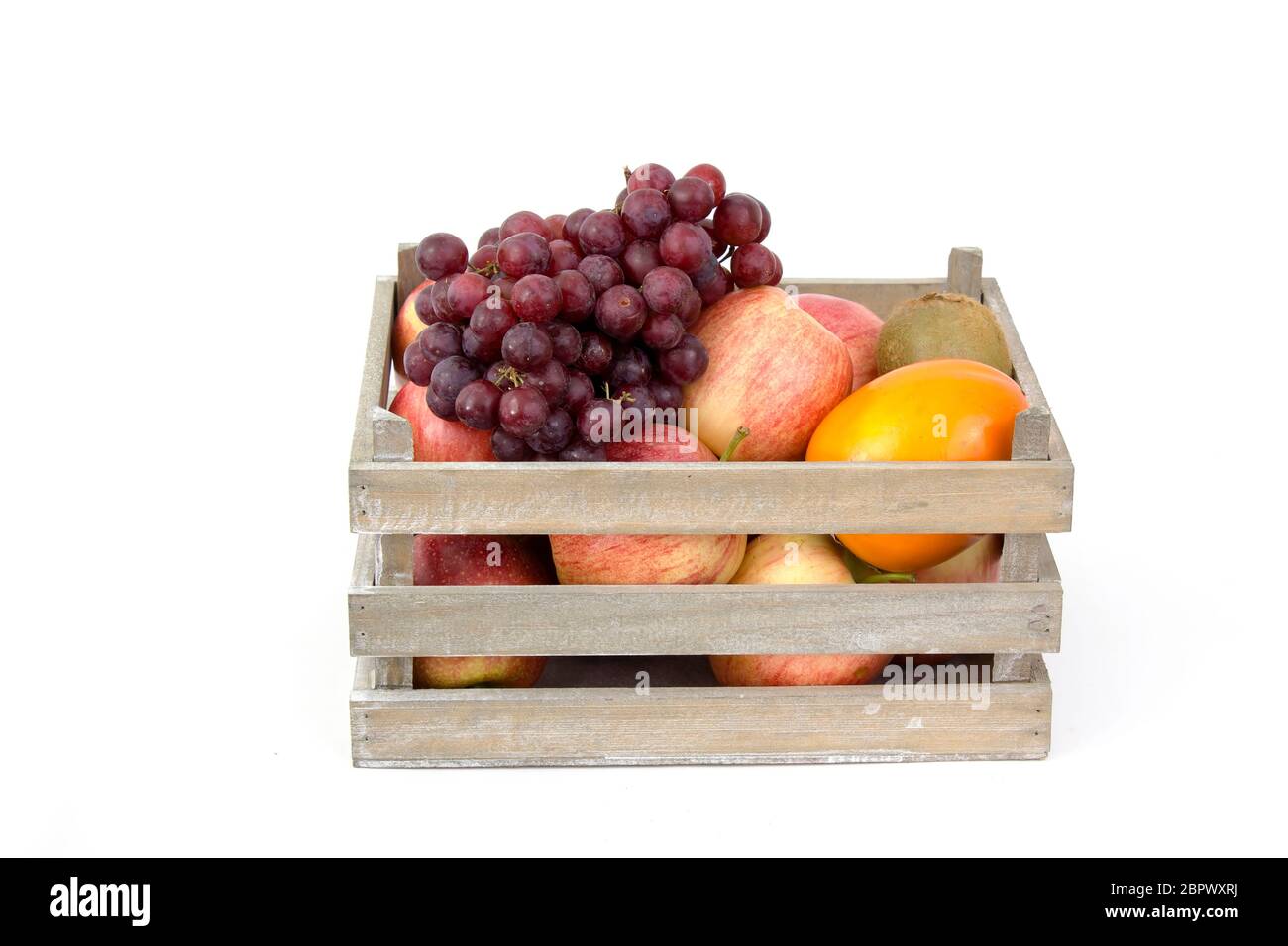 fresh fruits in a box on white background Stock Photo - Alamy