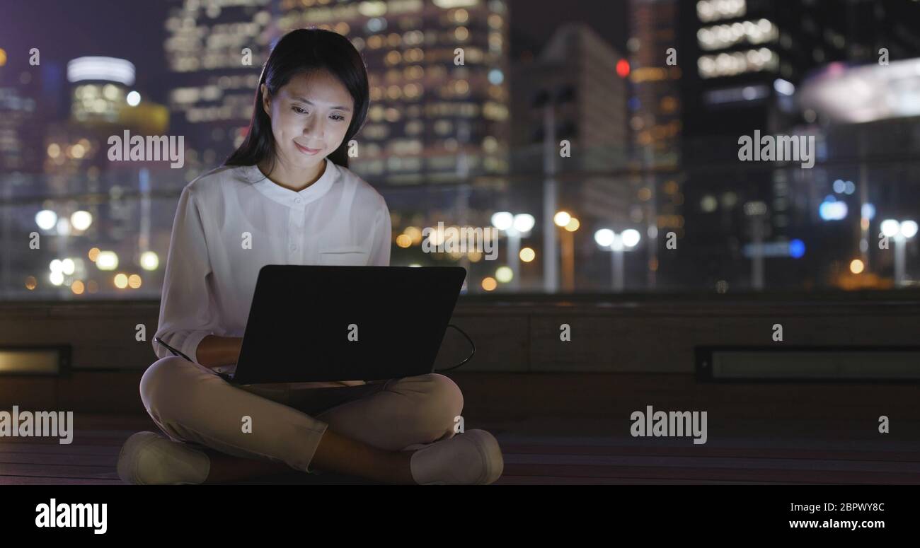Business woman working on laptop computer at outdoor Stock Photo - Alamy