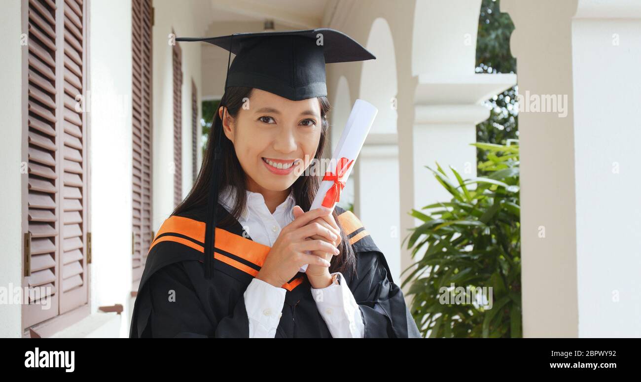 Excited woman get graduation in university campus Stock Photo - Alamy