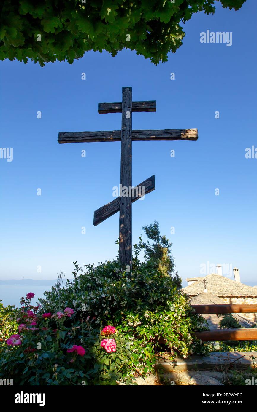 Huge wooden Orthodox eight-pointed cross against the sky after the dawn ...