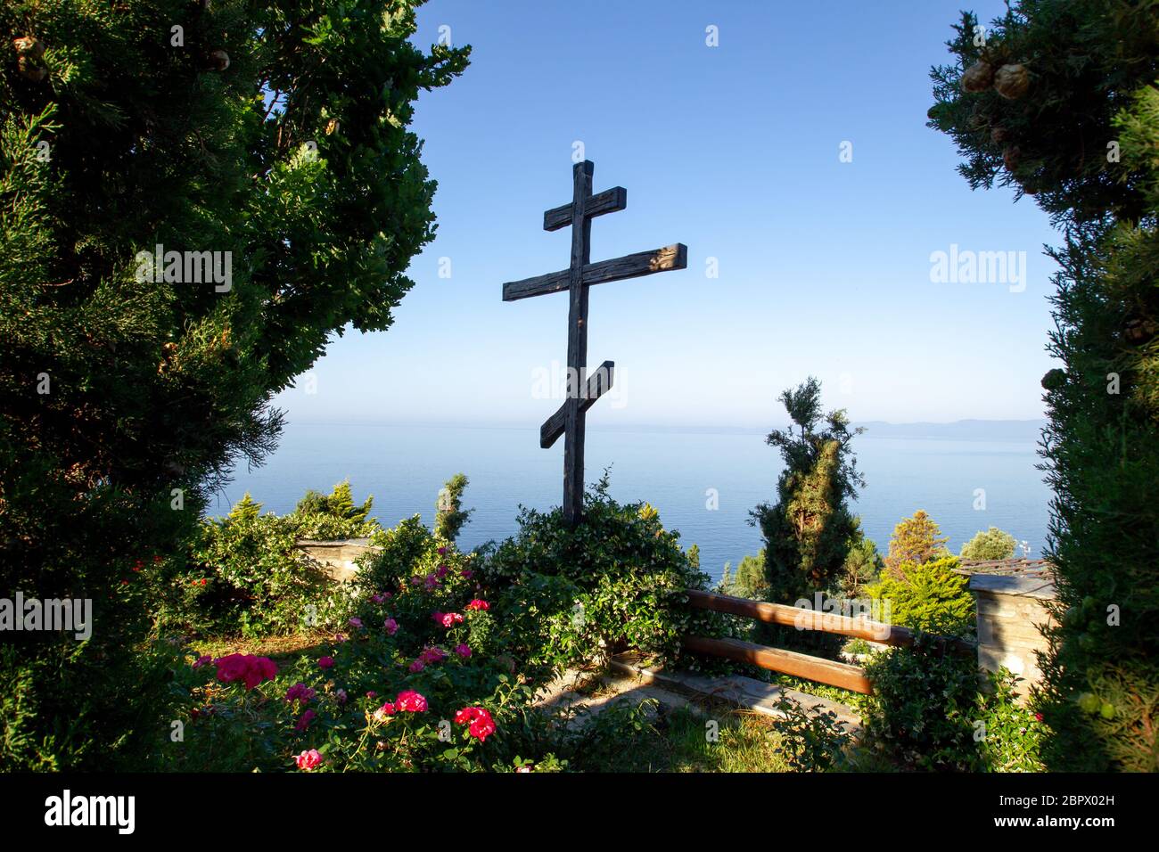 Huge wooden Orthodox eight-pointed cross against the sky after the dawn ...
