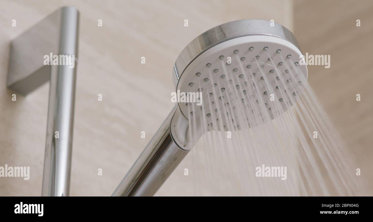 Water flow in the shower head Stock Photo - Alamy