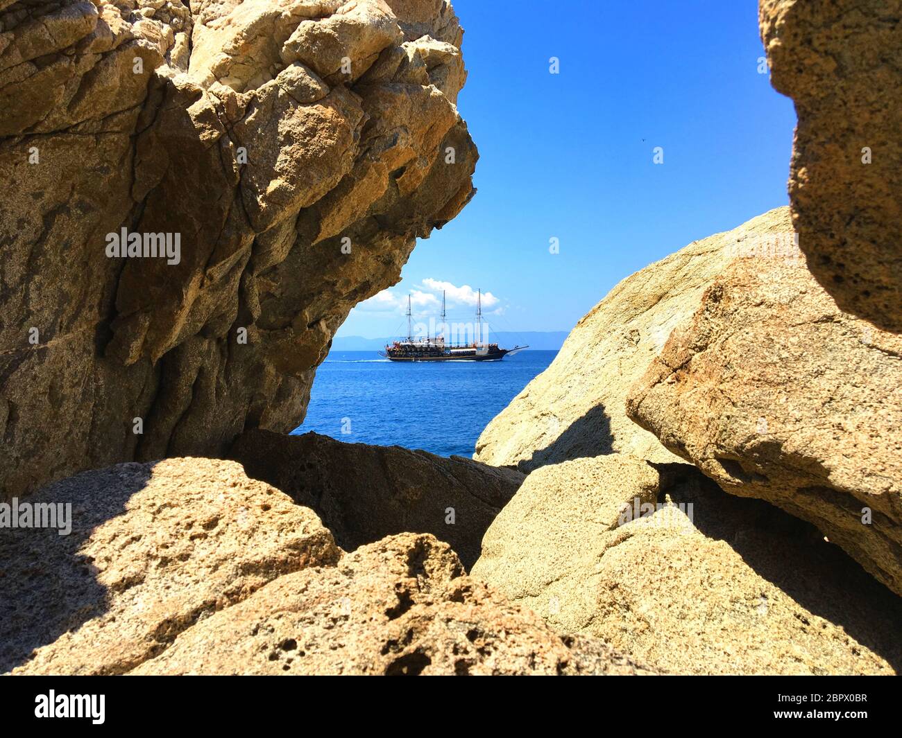 Holy Mount Athos. Ship sailing between rocks Stock Photo - Alamy