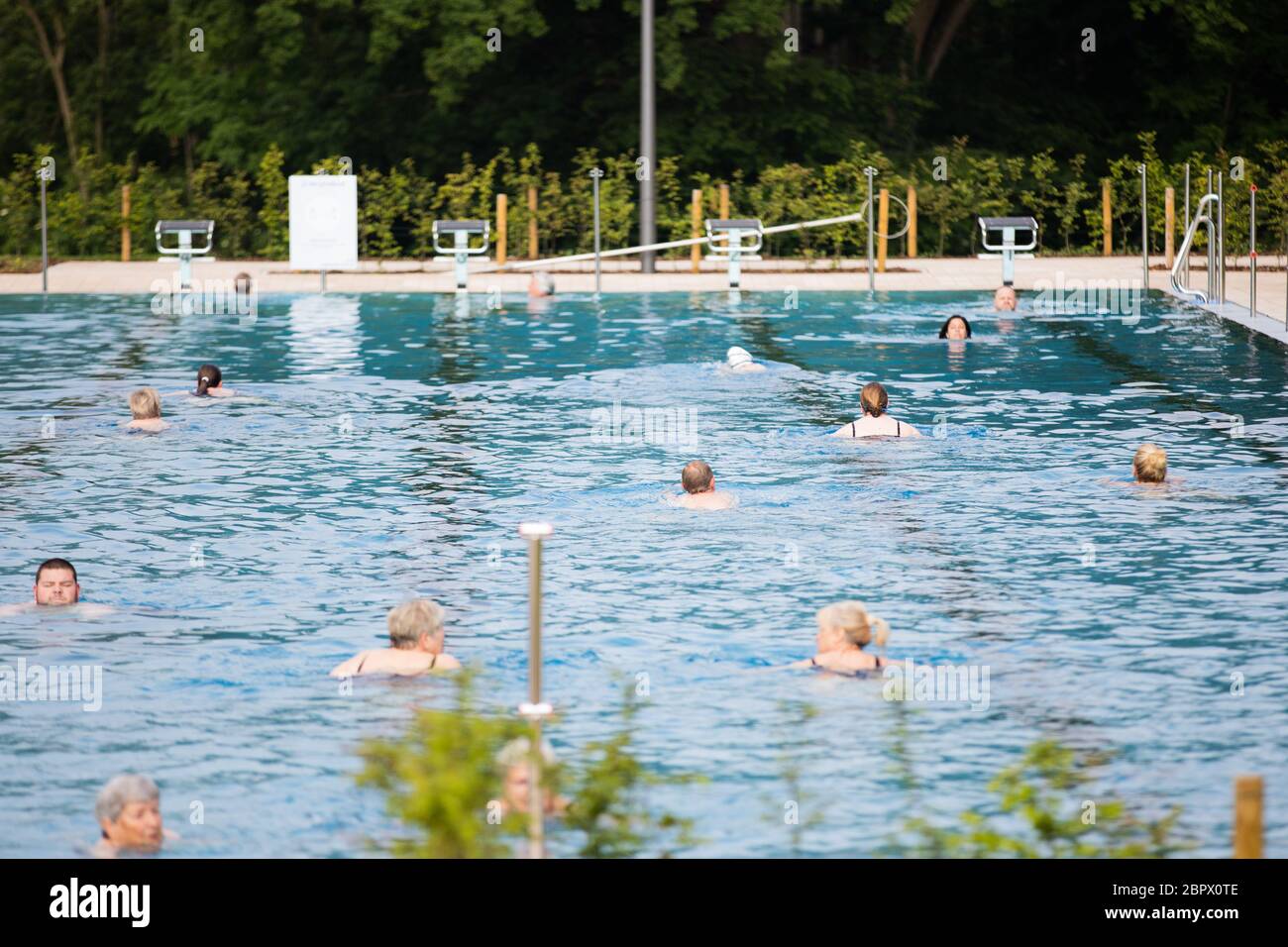 Ochtrup, Germany. 20th May, 2020. Guests swim in the swimming pool in ...
