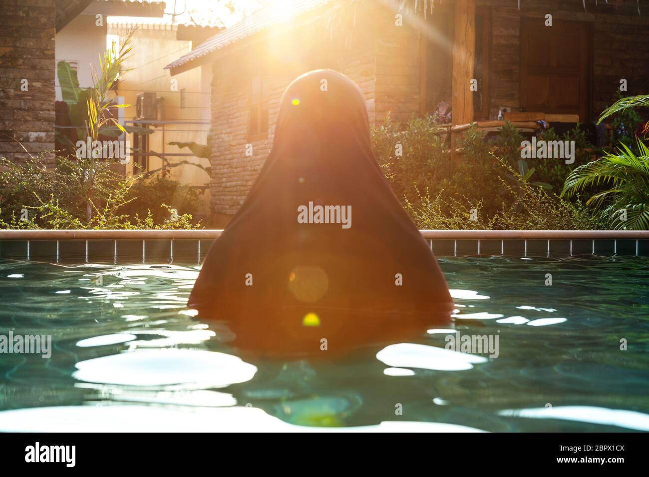 Pool woman muslim hi-res stock photography and images - Alamy