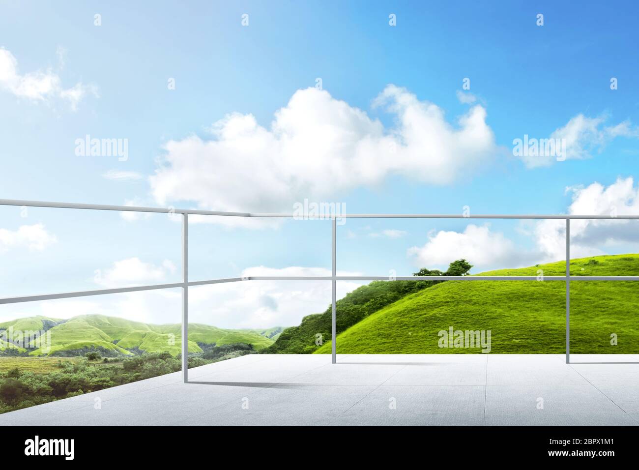 Terrace of building with iron fence and green landscapes view with blue ...
