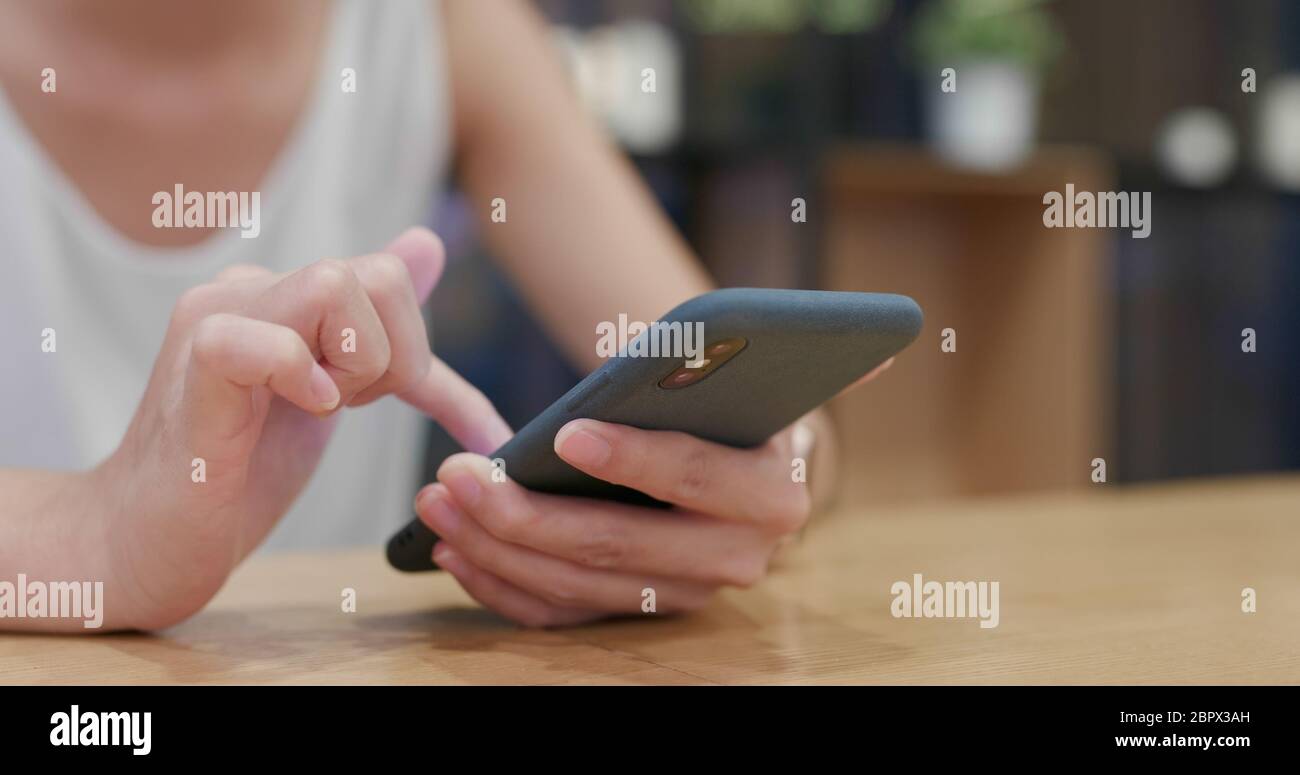 Woman use of smart phone with blur background Stock Photo - Alamy