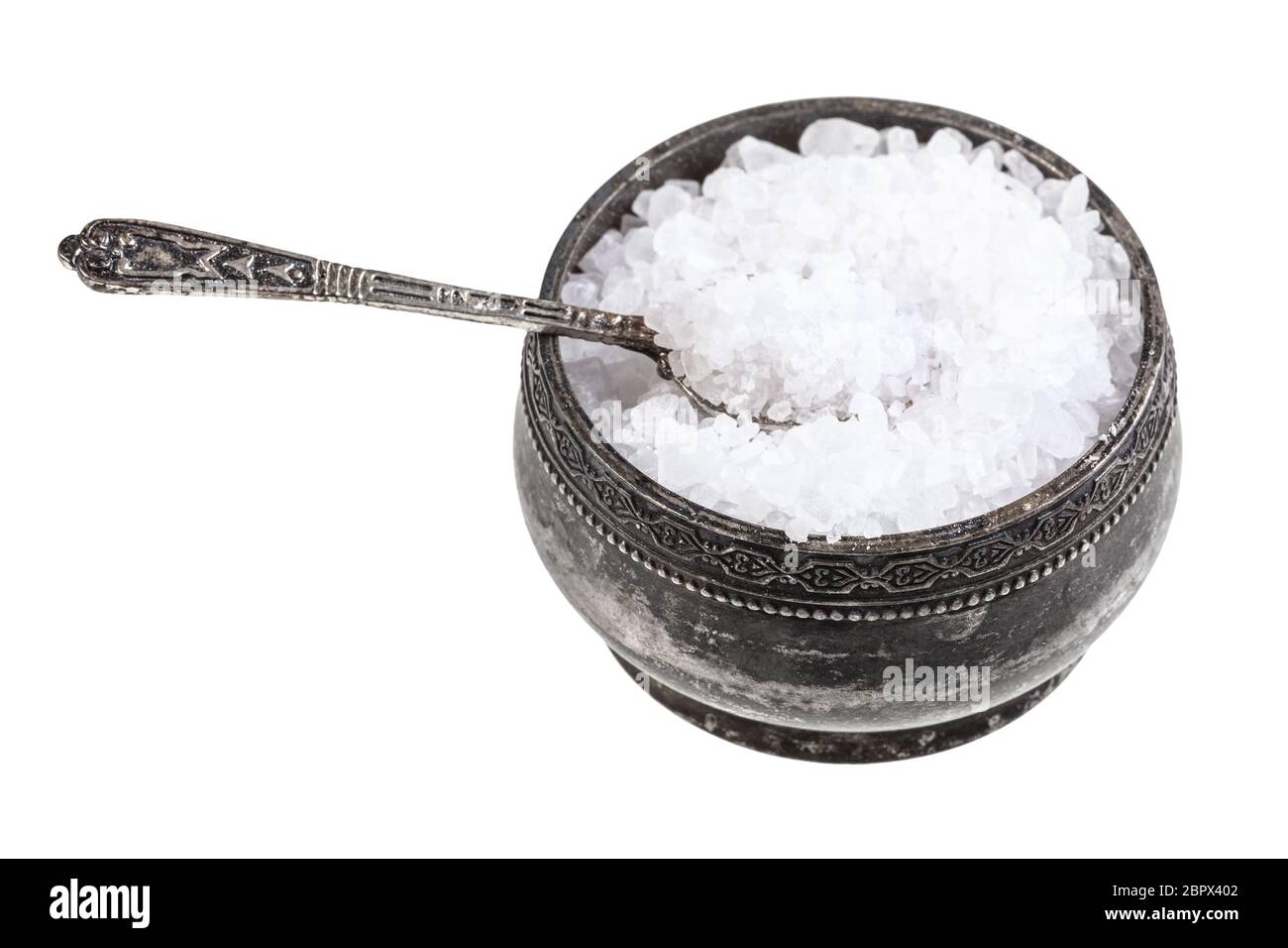 old silver salt cellar with spoon with coarse grained Sea Salt isolated ...