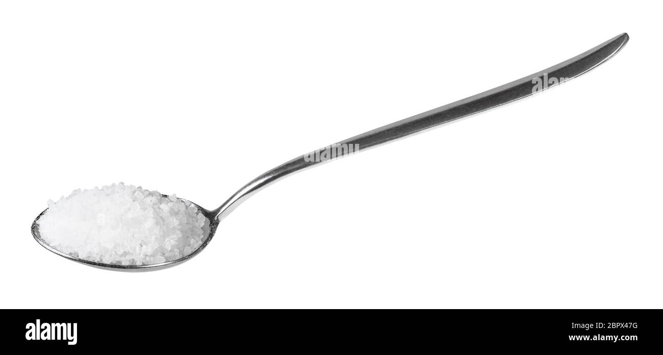 side view of tablespoon with coarse grained Sea Salt isolated on white ...