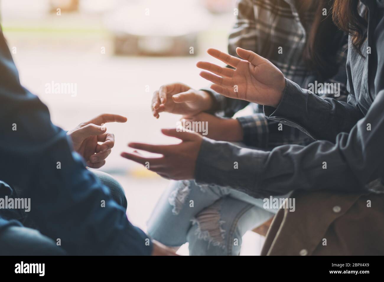 People sitting and talking together Stock Photo - Alamy