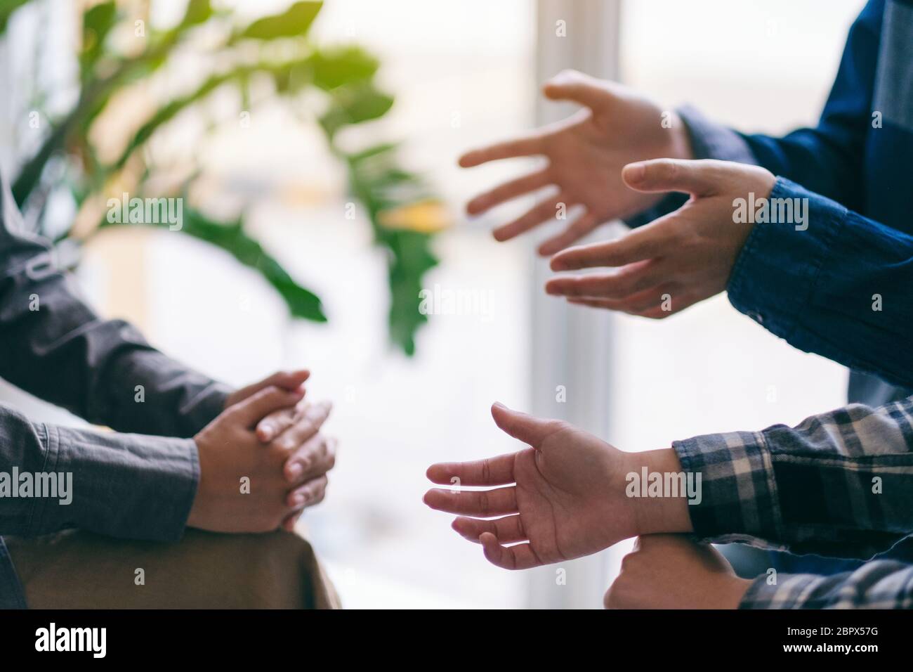People sitting and talking together Stock Photo - Alamy