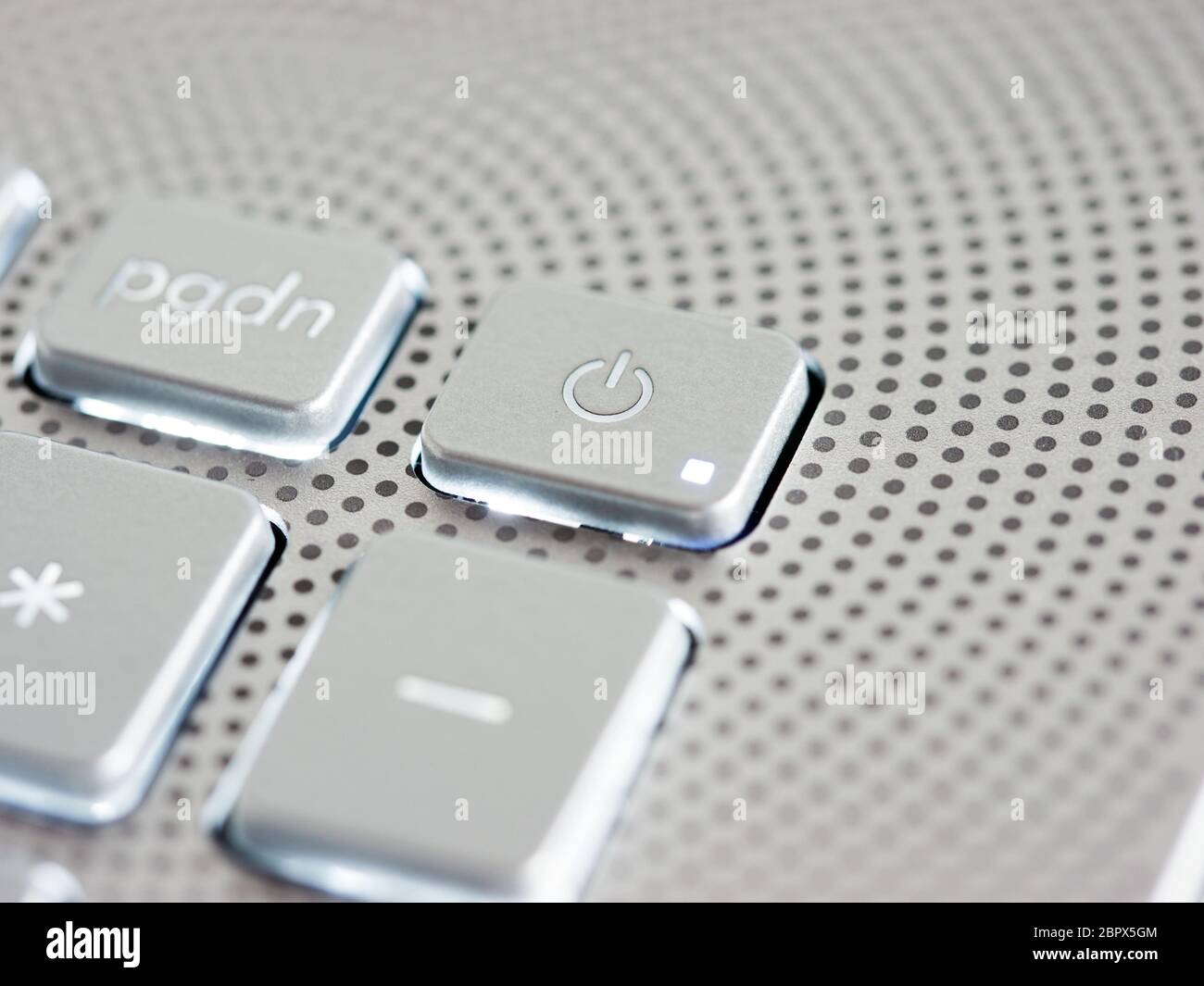 Silver laptop power button hi-res stock photography and images - Alamy