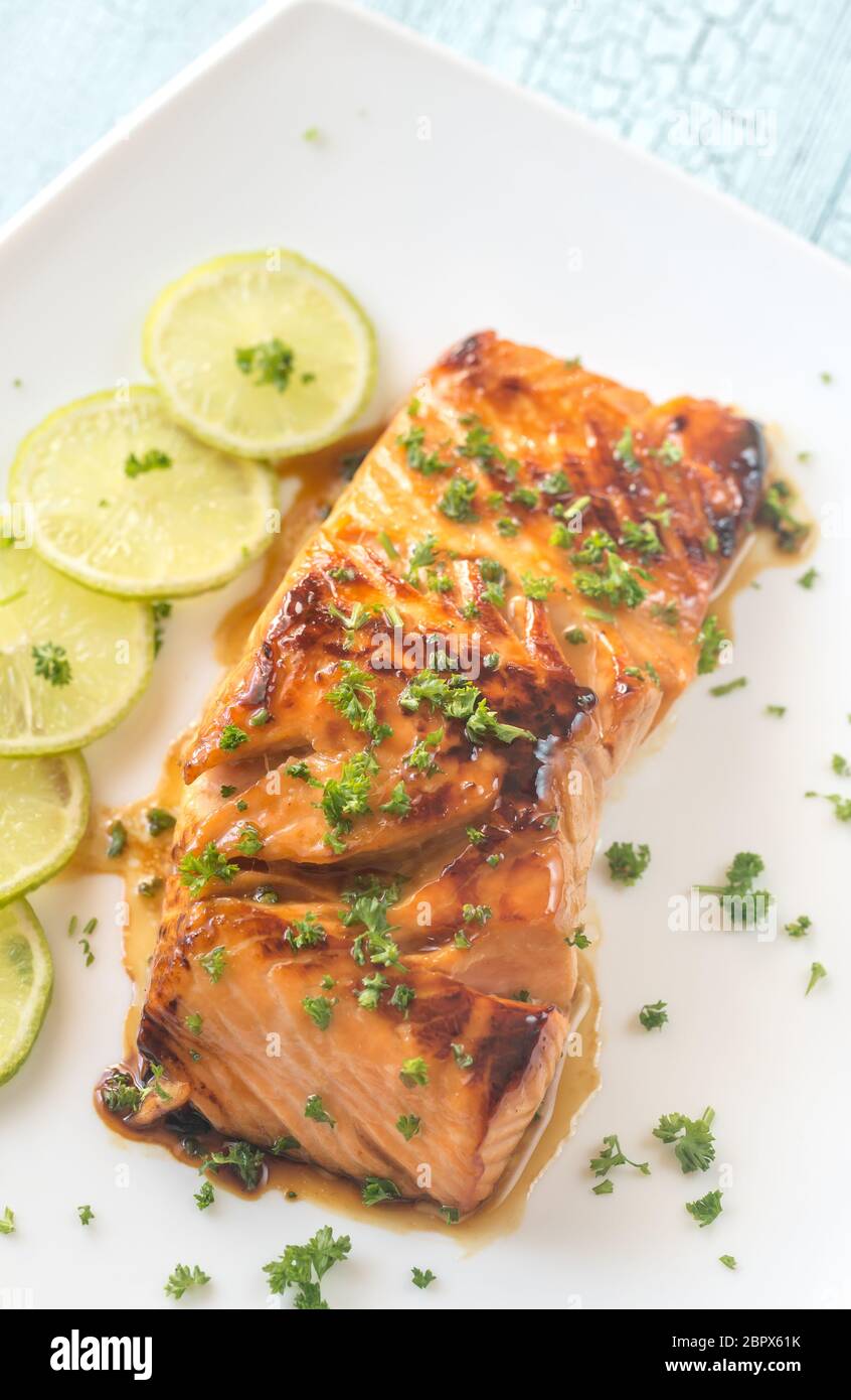 Honey lime salmon on the plate Stock Photo - Alamy