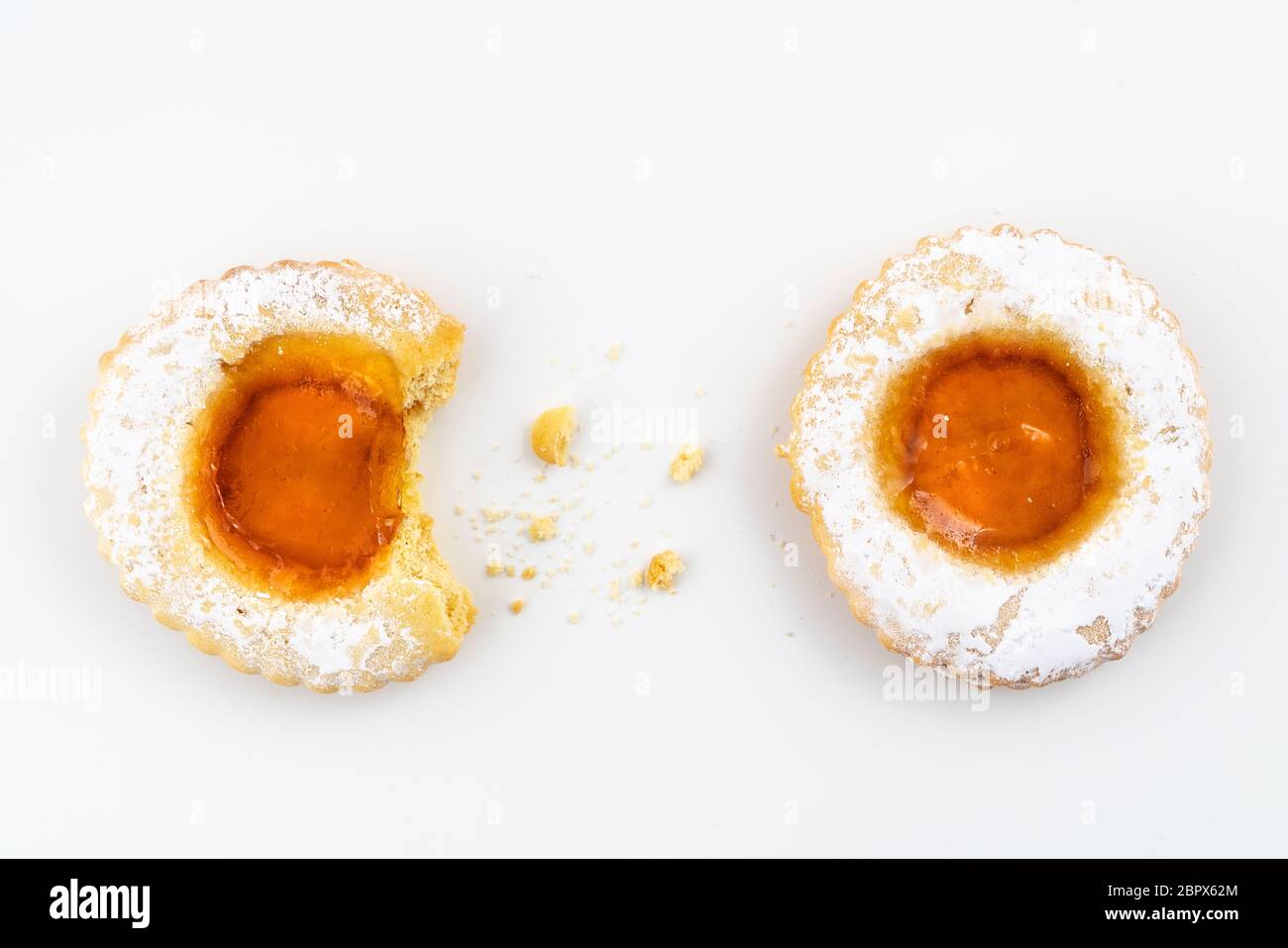 round pastries of pastry and jam on a white surface Stock Photo - Alamy