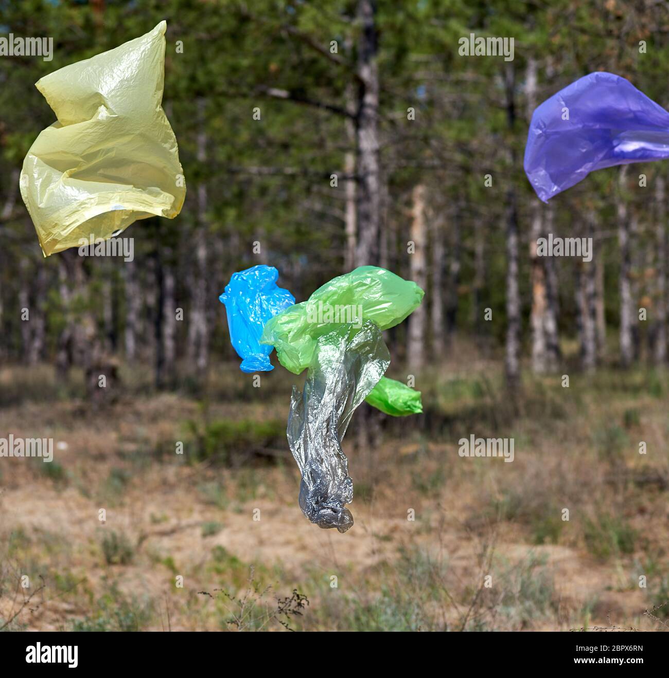 empty plastic garbage bags fly in nature, concept of environmental ...