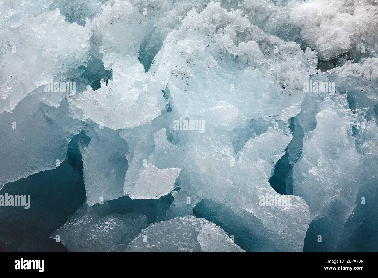 Ice block melting off an iceberg, icy structure closeup Stock Photo - Alamy