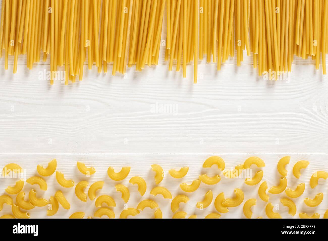 Dried pasta selection on wooden white background. Top view Stock Photo ...