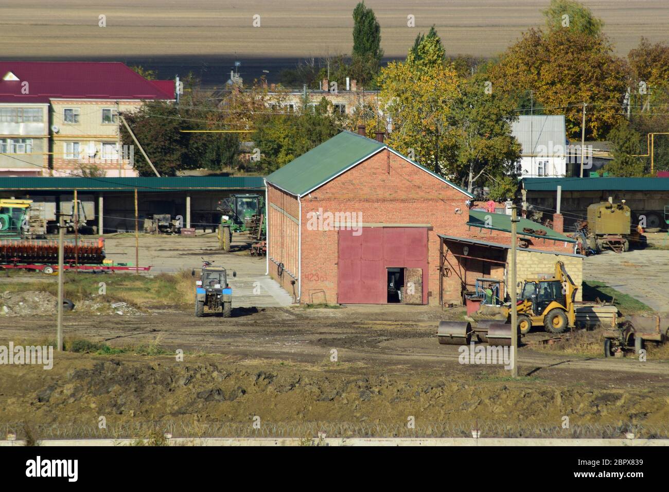 View of the farm garage. Parking of agricultural machinery Stock Photo ...