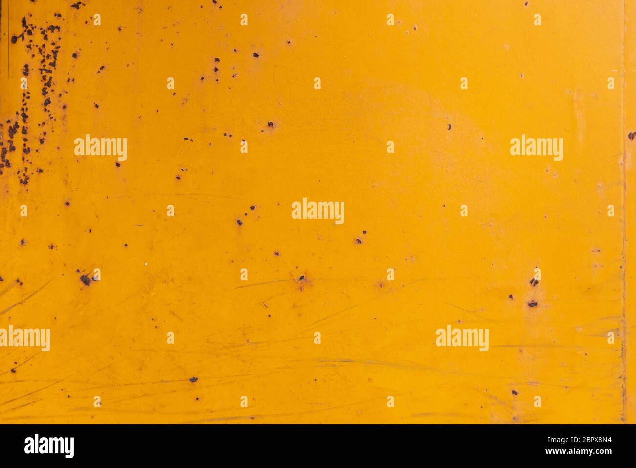 Yellow painted old rusty metal surface. An oxidized weathered surface ...