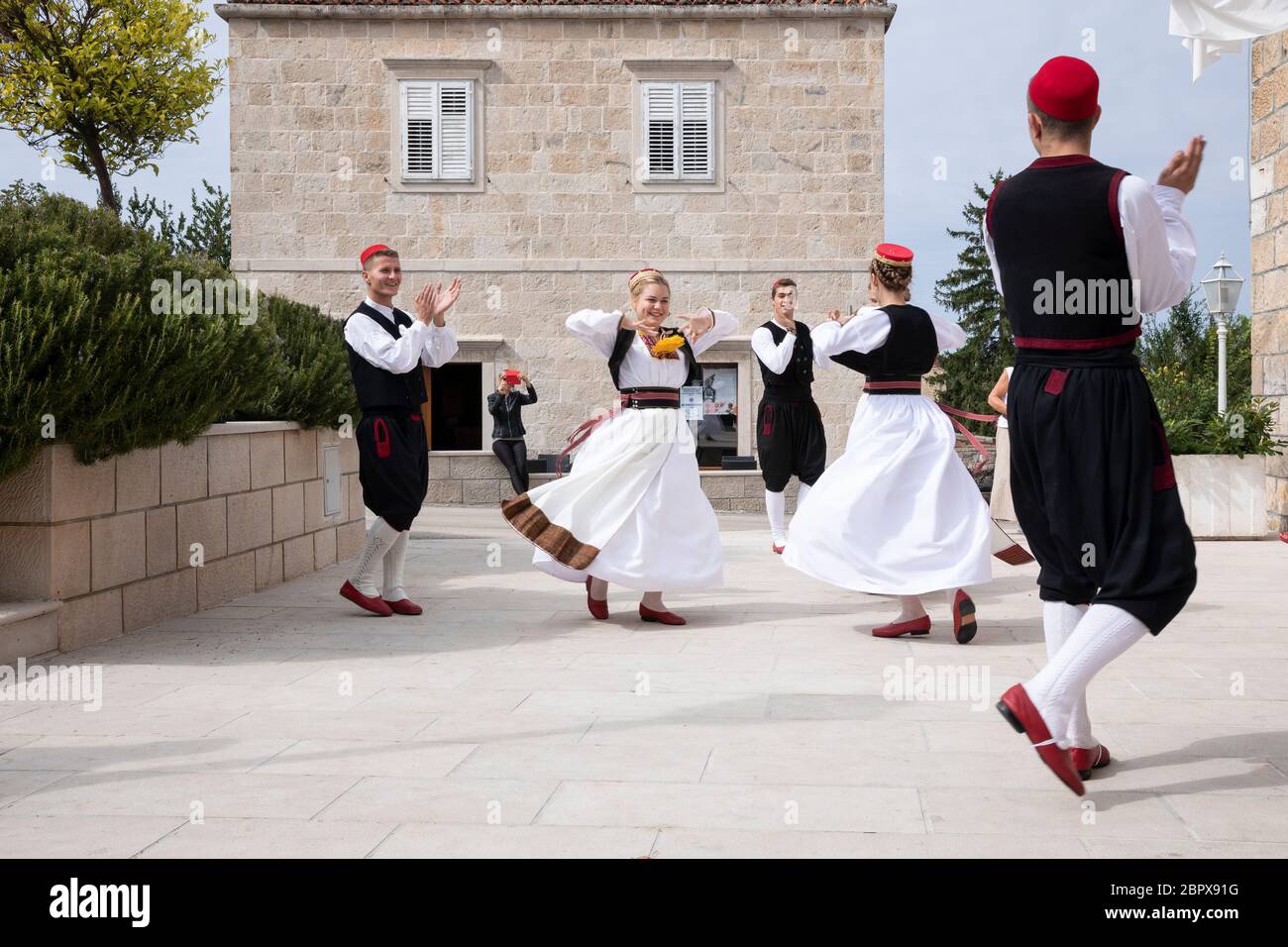 Konavle, Croatia, Oktober 5th 2019. Men and woman wearing traditional ...