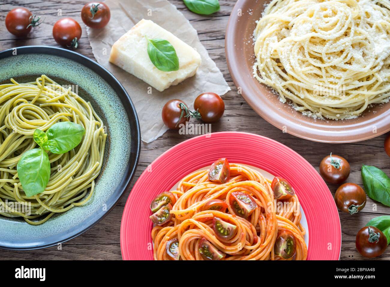Portions of colorful spaghetti with ingredients Stock Photo - Alamy