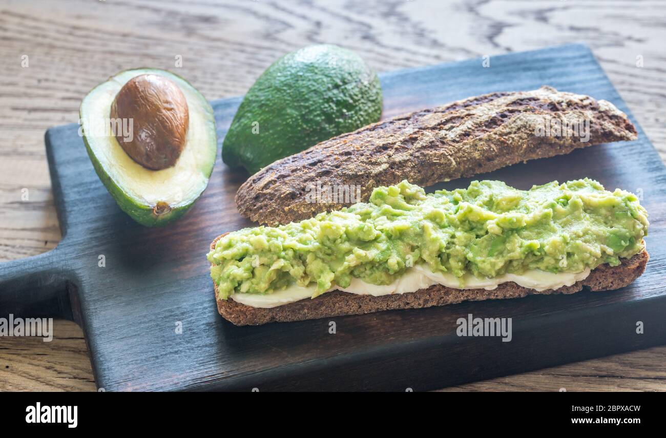 Sandwich with smashed avocado Stock Photo - Alamy