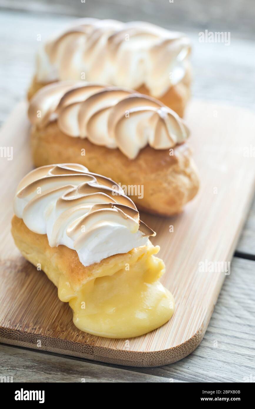Eclairs with lemon curd and meringue Stock Photo - Alamy