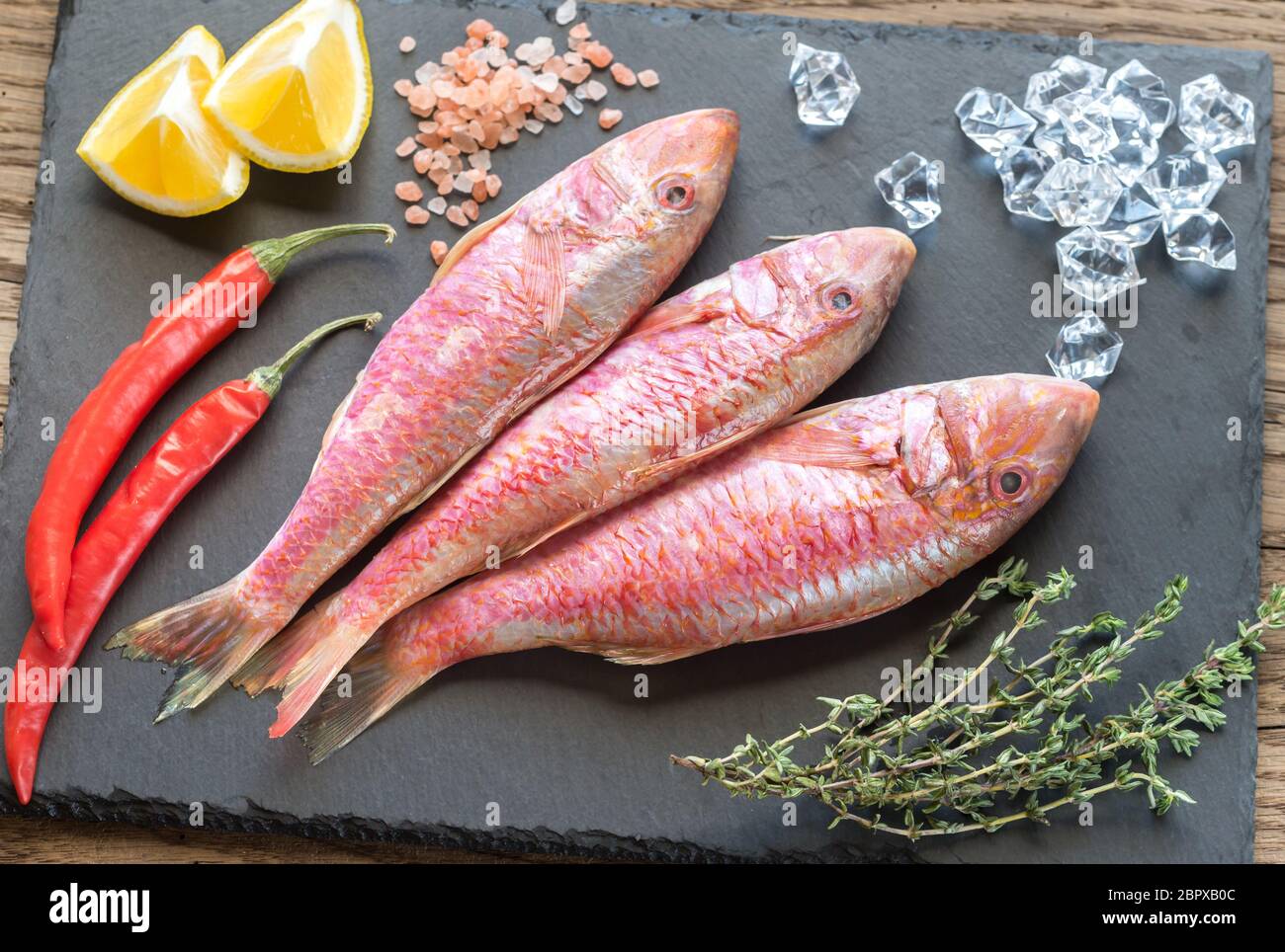 Raw red mullet with ingredients Stock Photo - Alamy