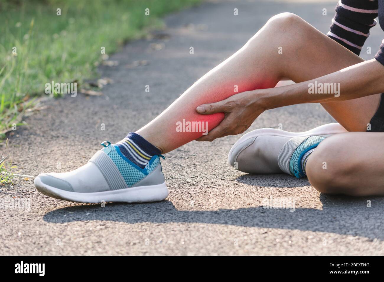 The female clings to a bad leg. The pain in her leg. Health and painful ...