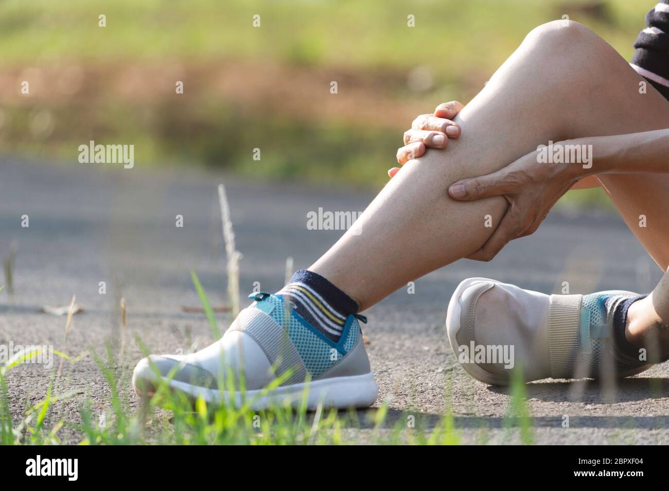 The female clings to a bad leg. The pain in her leg. Health and painful ...