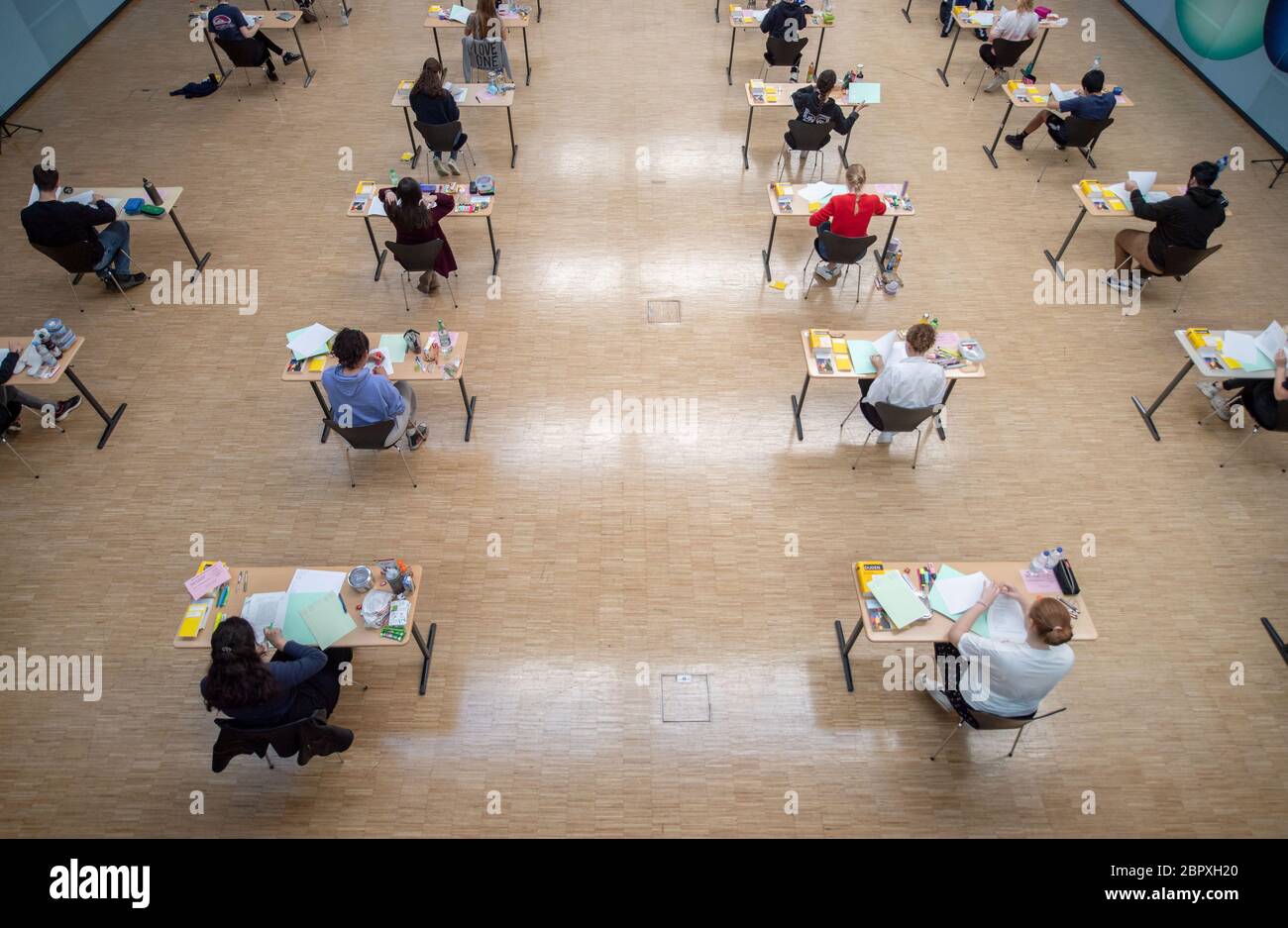 Stuttgart, Germany. 20th May, 2020. Pupils sit in the assembly hall of ...