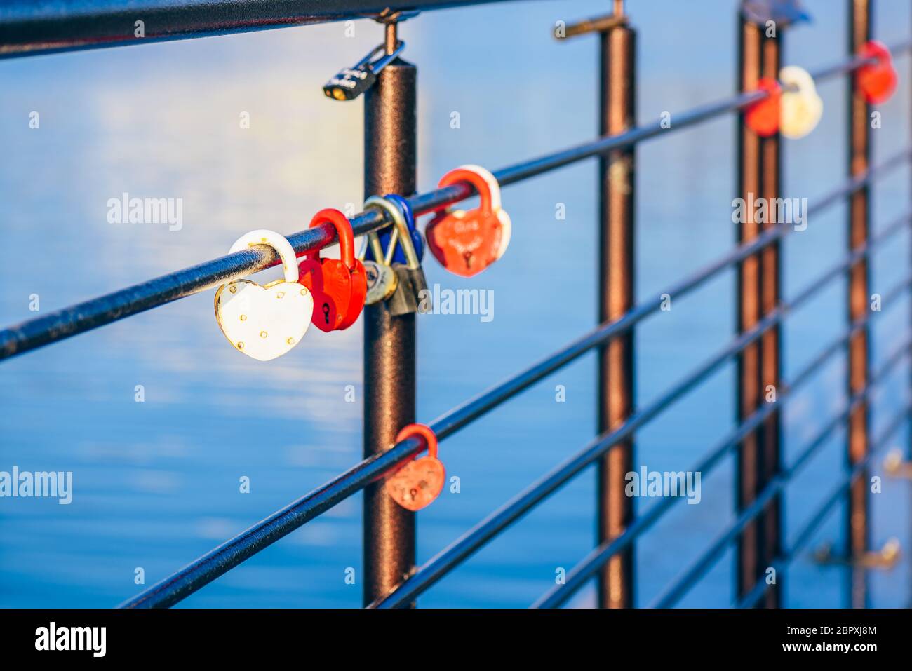 Sign hanging on railings hi-res stock photography and images - Alamy